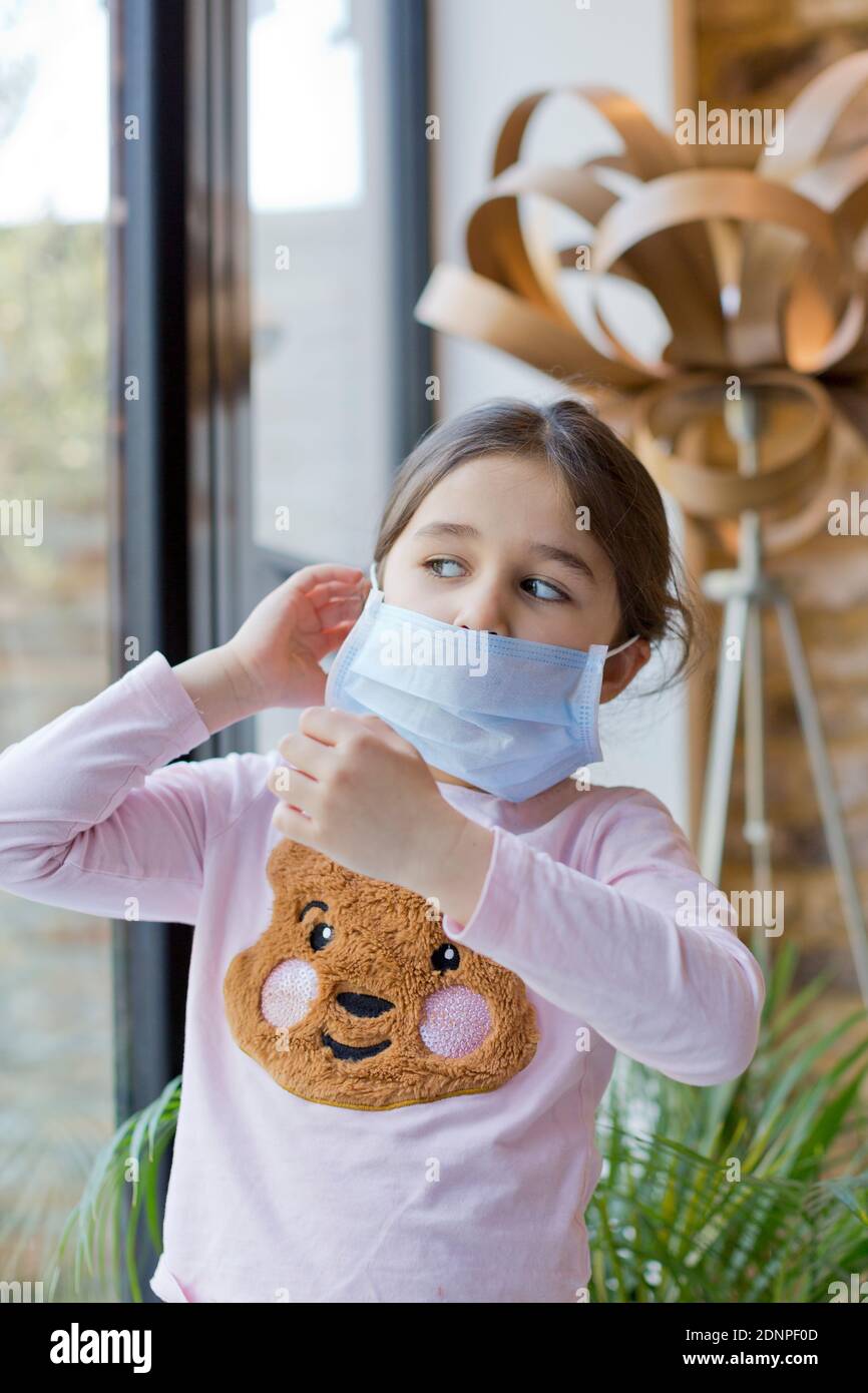 Girl standing wearing mask hi-res stock photography and images - Alamy