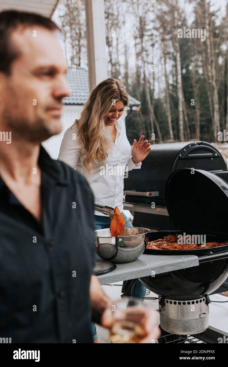 Woman having barbecue Stock Photo - Alamy