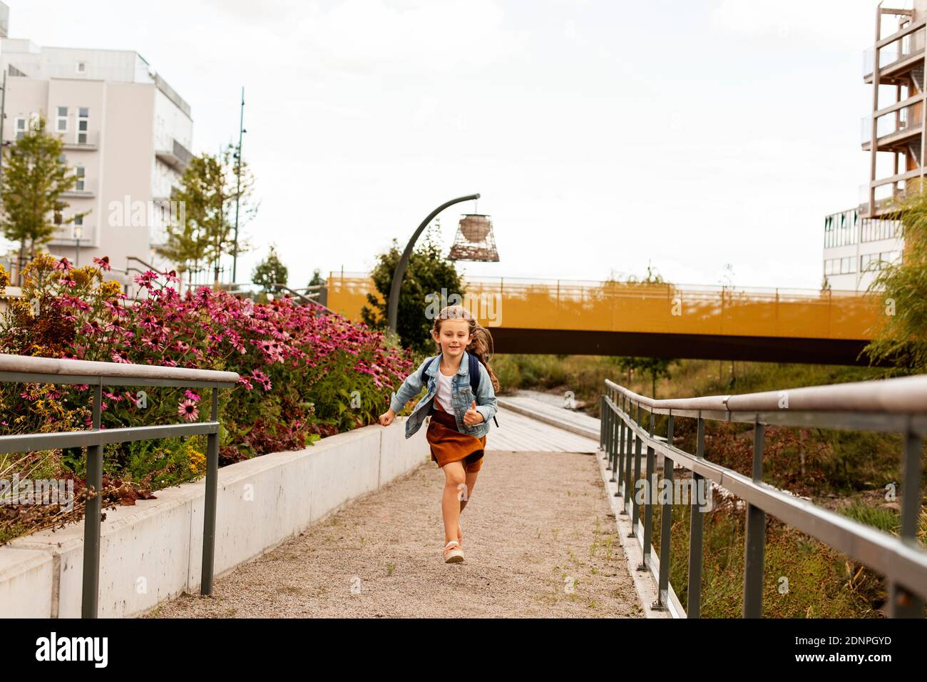 Girl running towards camera Stock Photo - Alamy