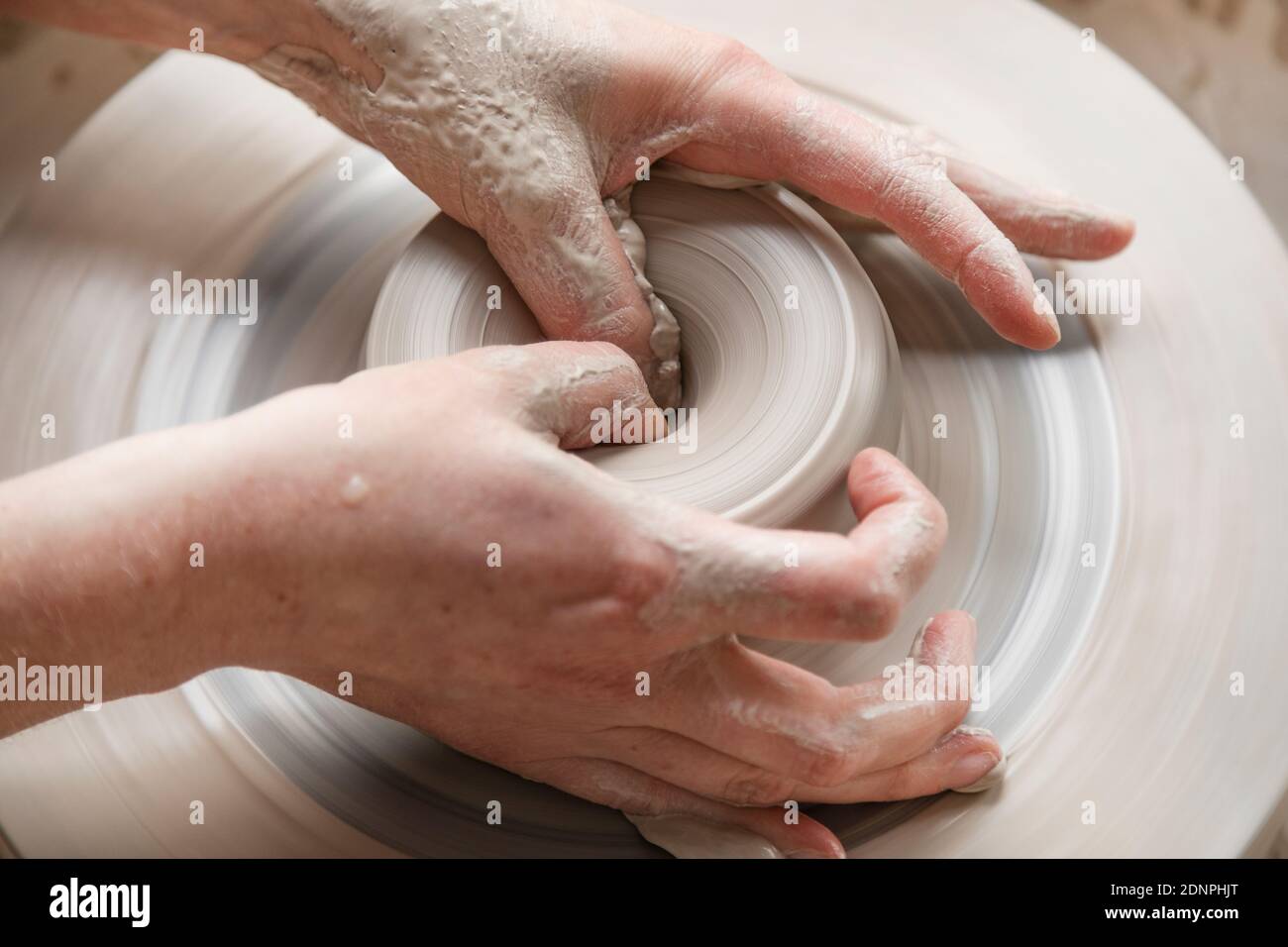 Womans hands modeling clay Stock Photo - Alamy