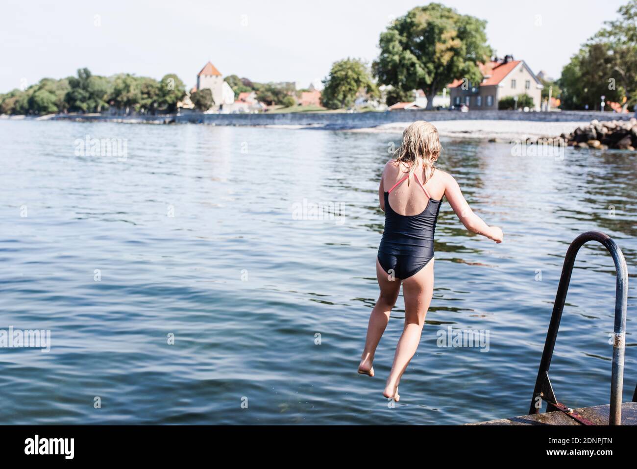 Girl jumping water hi-res stock photography and images - Alamy