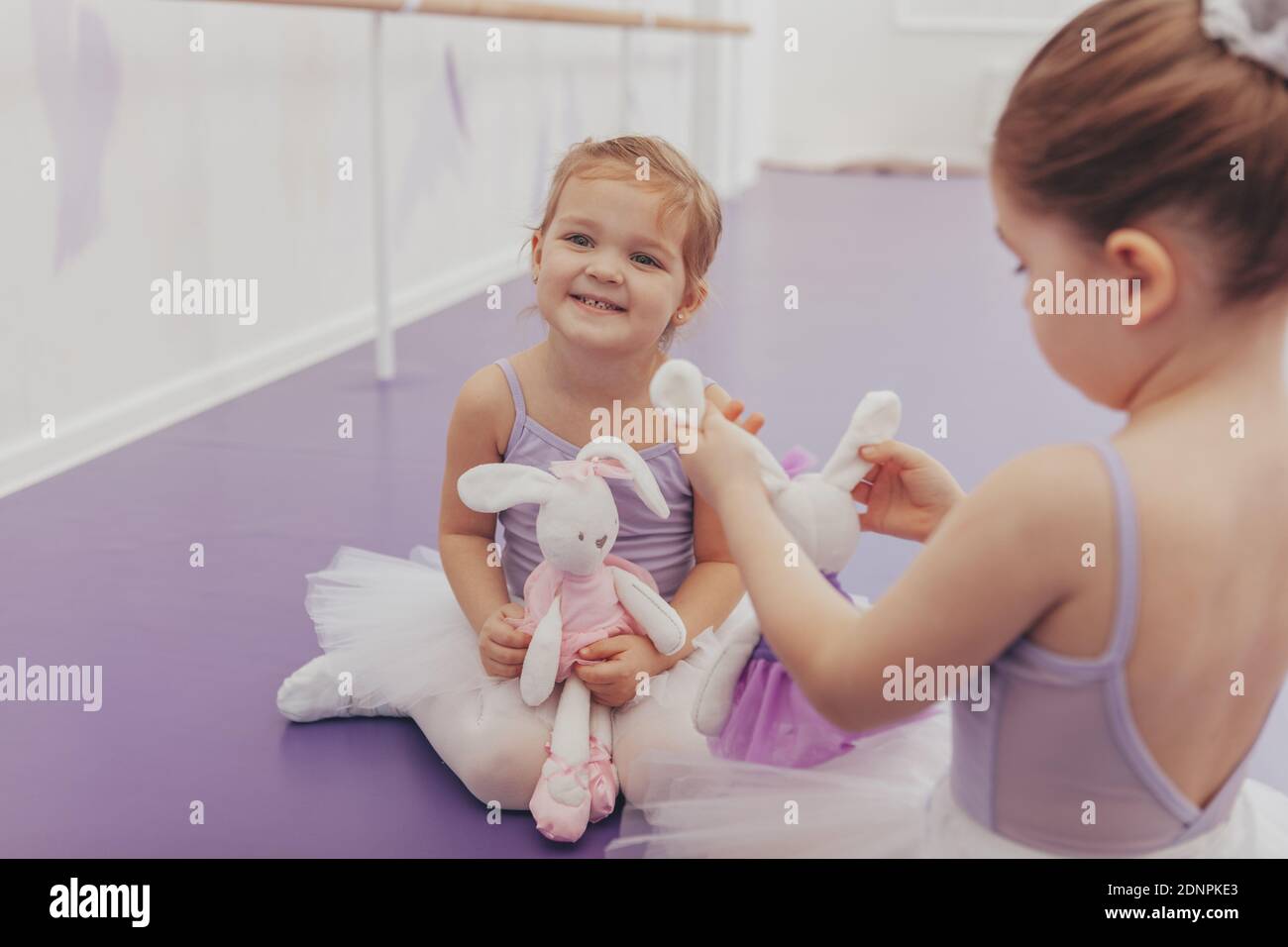 Happy little cute girl wearing tutu and leotard laughing joyfully ...