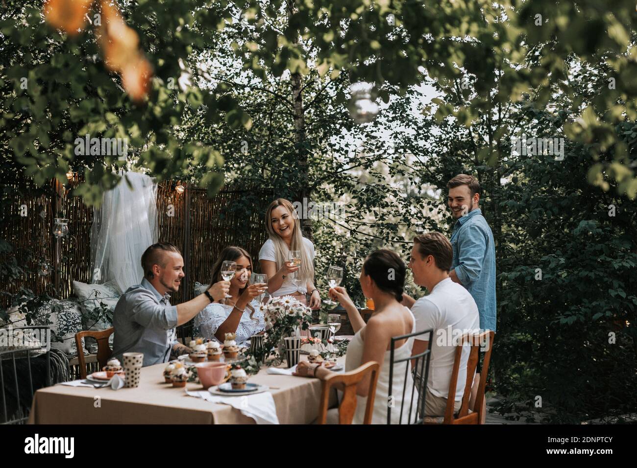 Garden summer friends group standing hi-res stock photography and ...