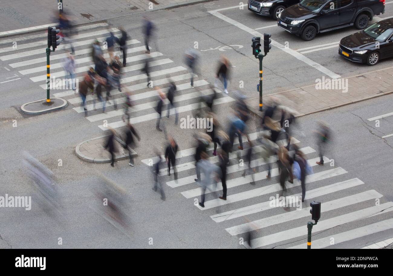 Pedestrians crossing road Stock Photo - Alamy
