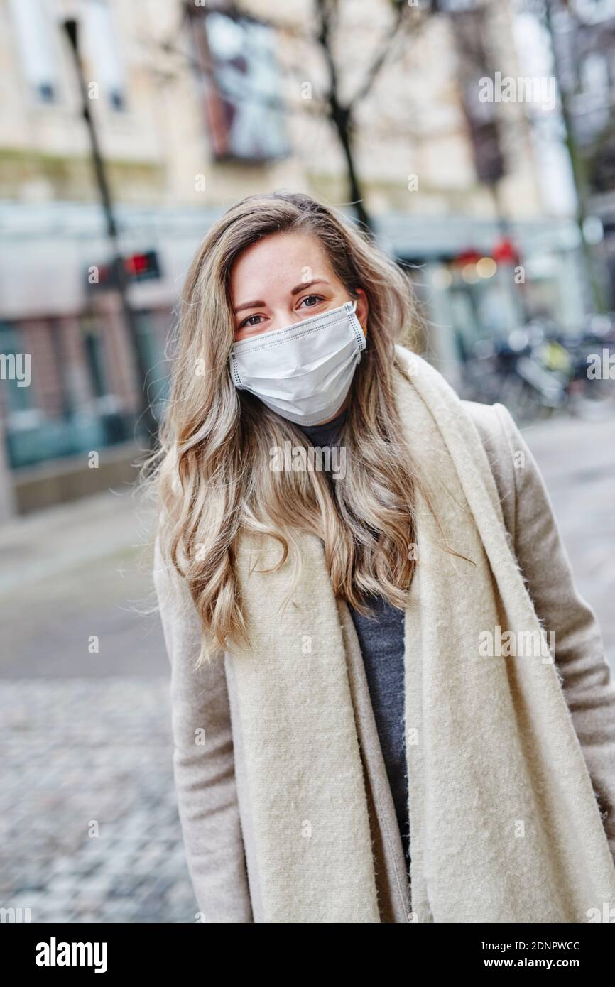 Blonde woman with face mask hi-res stock photography and images - Alamy