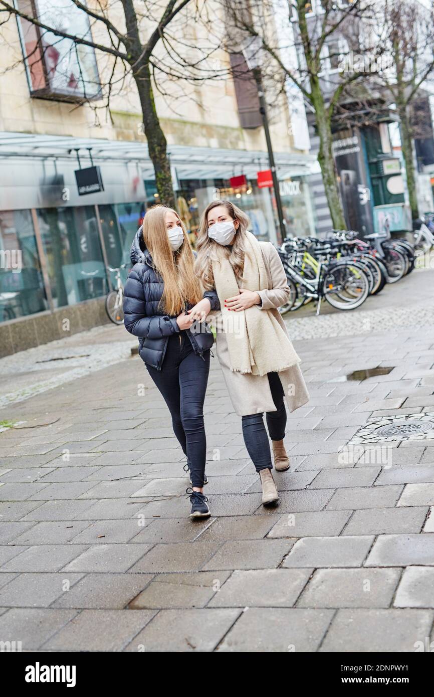 Female friends having walk together Stock Photo - Alamy