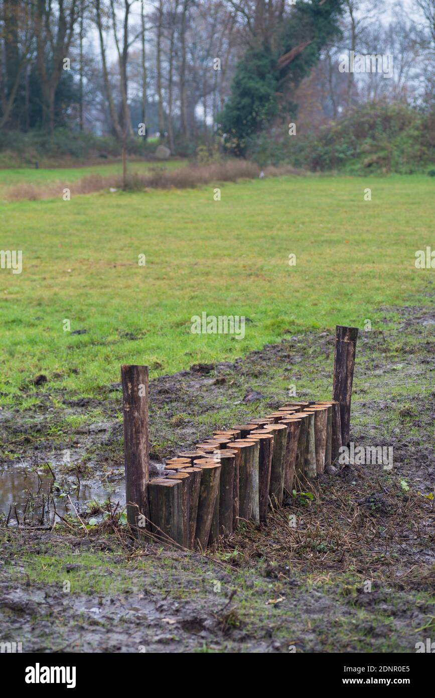 man-made obstacles in a ditch to retain the water as long as possible ...