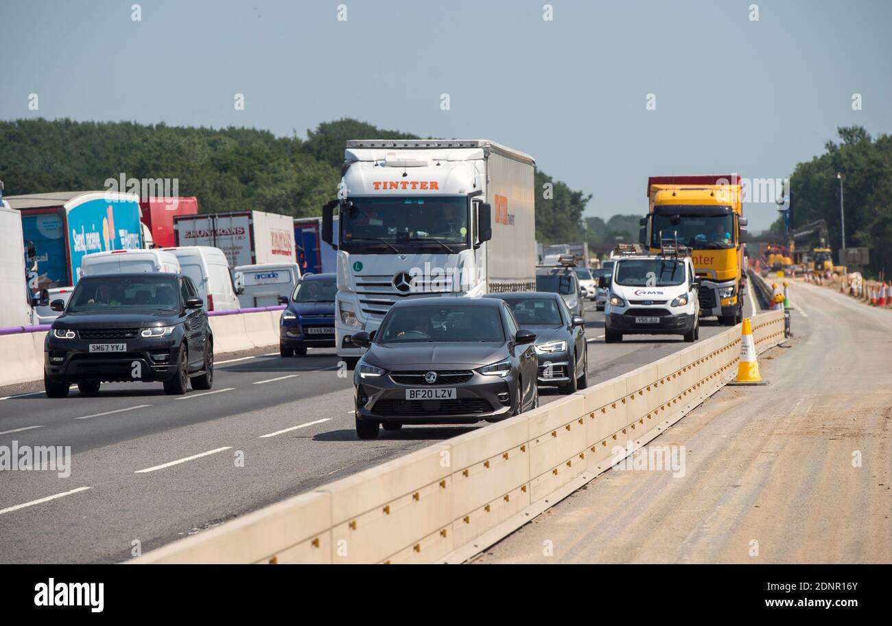Traffic travelling alongside roadworks on the M1 motorway in the ...