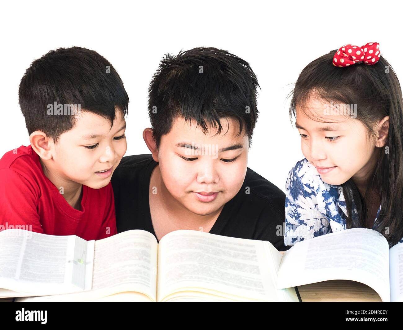 Asian siblings reading book hi-res stock photography and images - Alamy