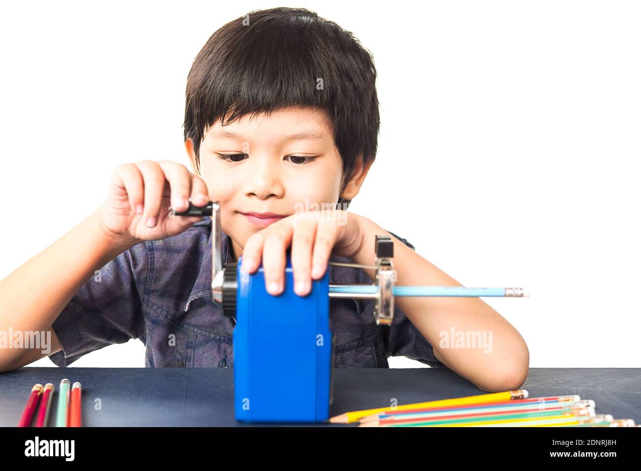 Boy sharpening pencil hi-res stock photography and images - Alamy