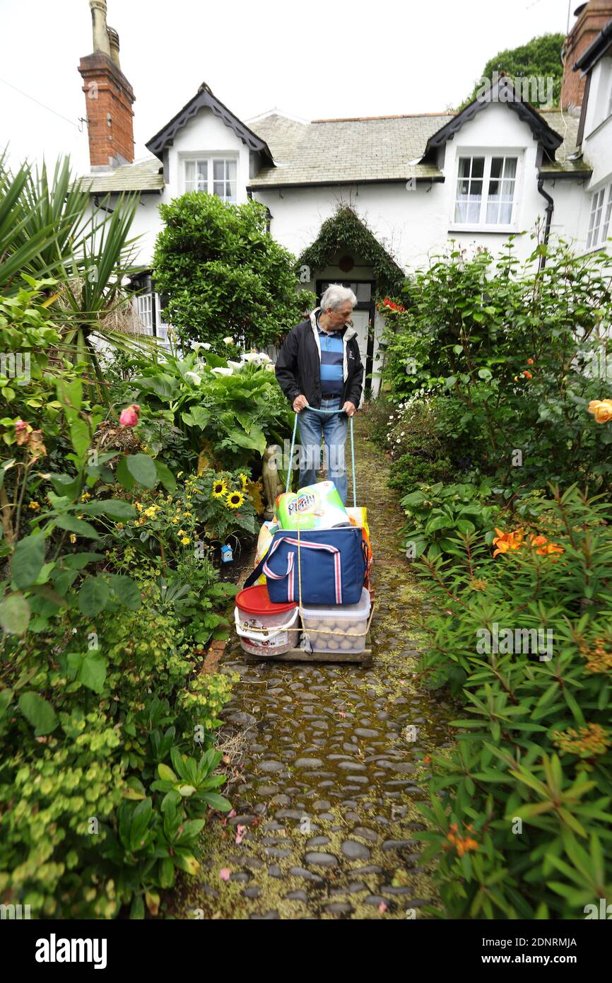Clovelly, a cliffside village in Devon, UK, emphasizing the unique ...