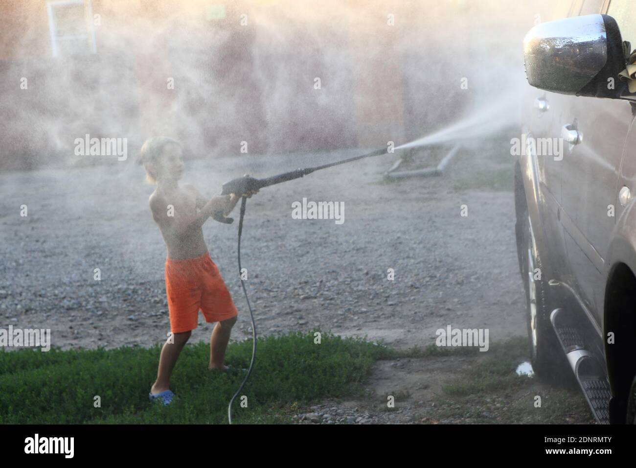 Boy washing car hi-res stock photography and images - Alamy