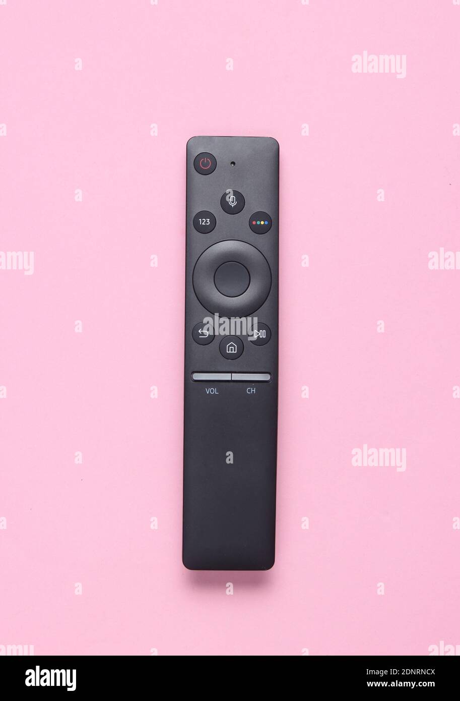 Modern TV remote control on a pink pastel background. Top view ...