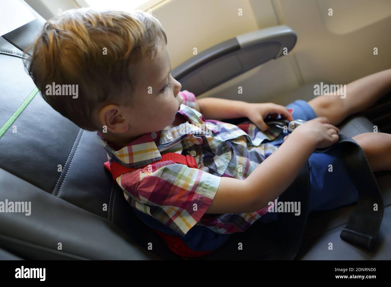 Portrait of a child in an airplane Stock Photo - Alamy