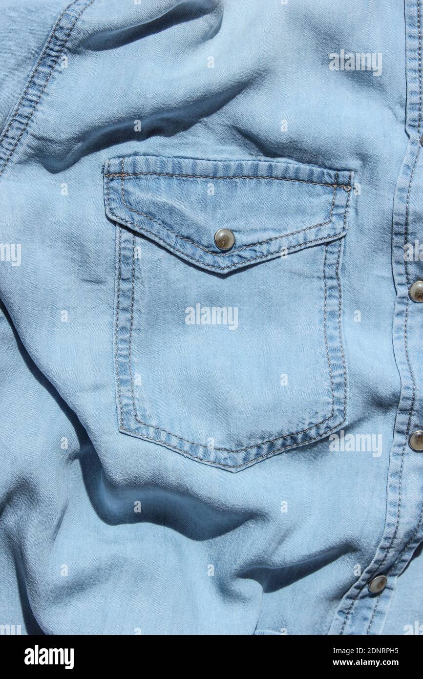 Pocket blue denim shirt Stock Photo - Alamy