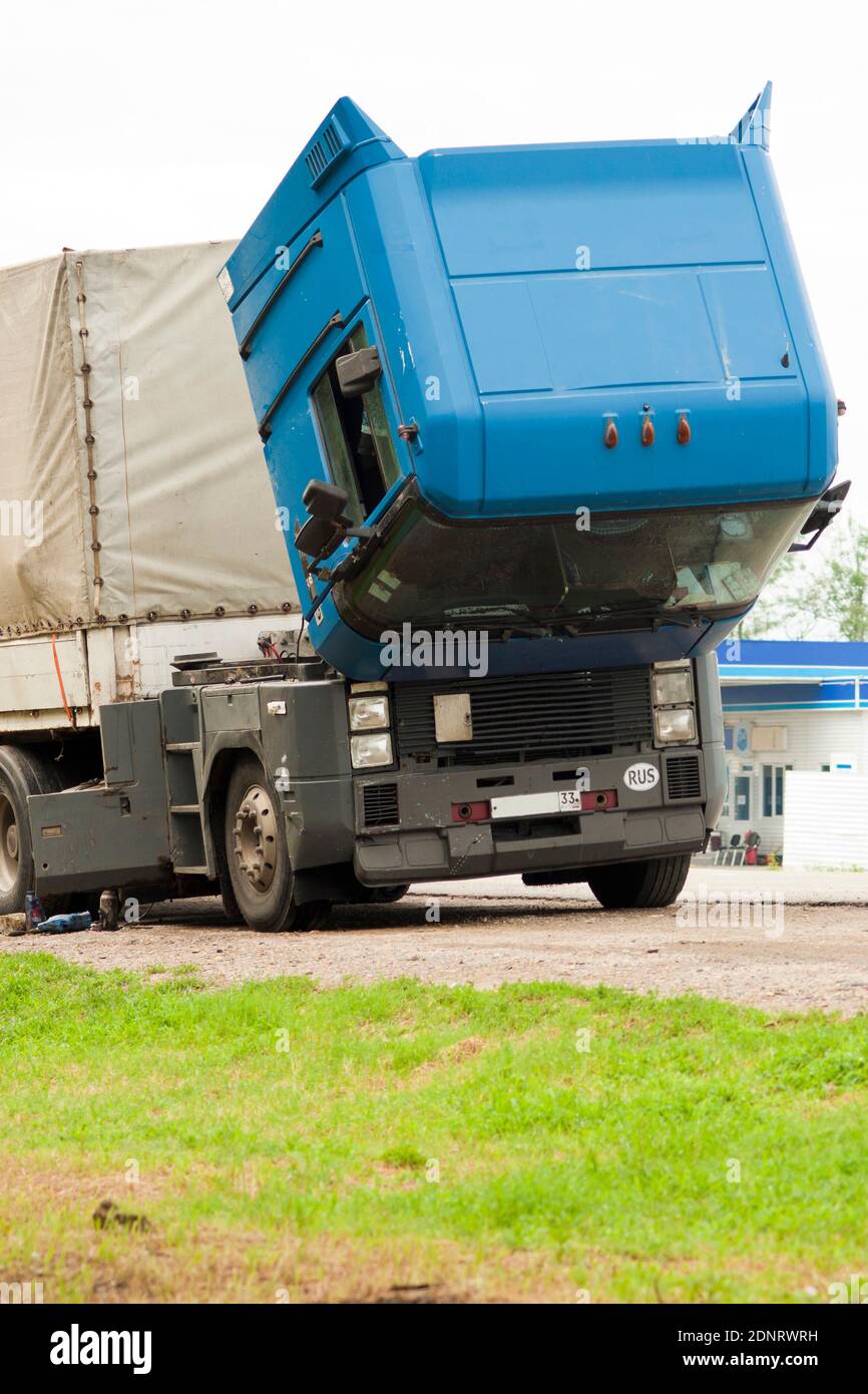 Faulty truck on the side of the road. An old cargo tractor with a ...