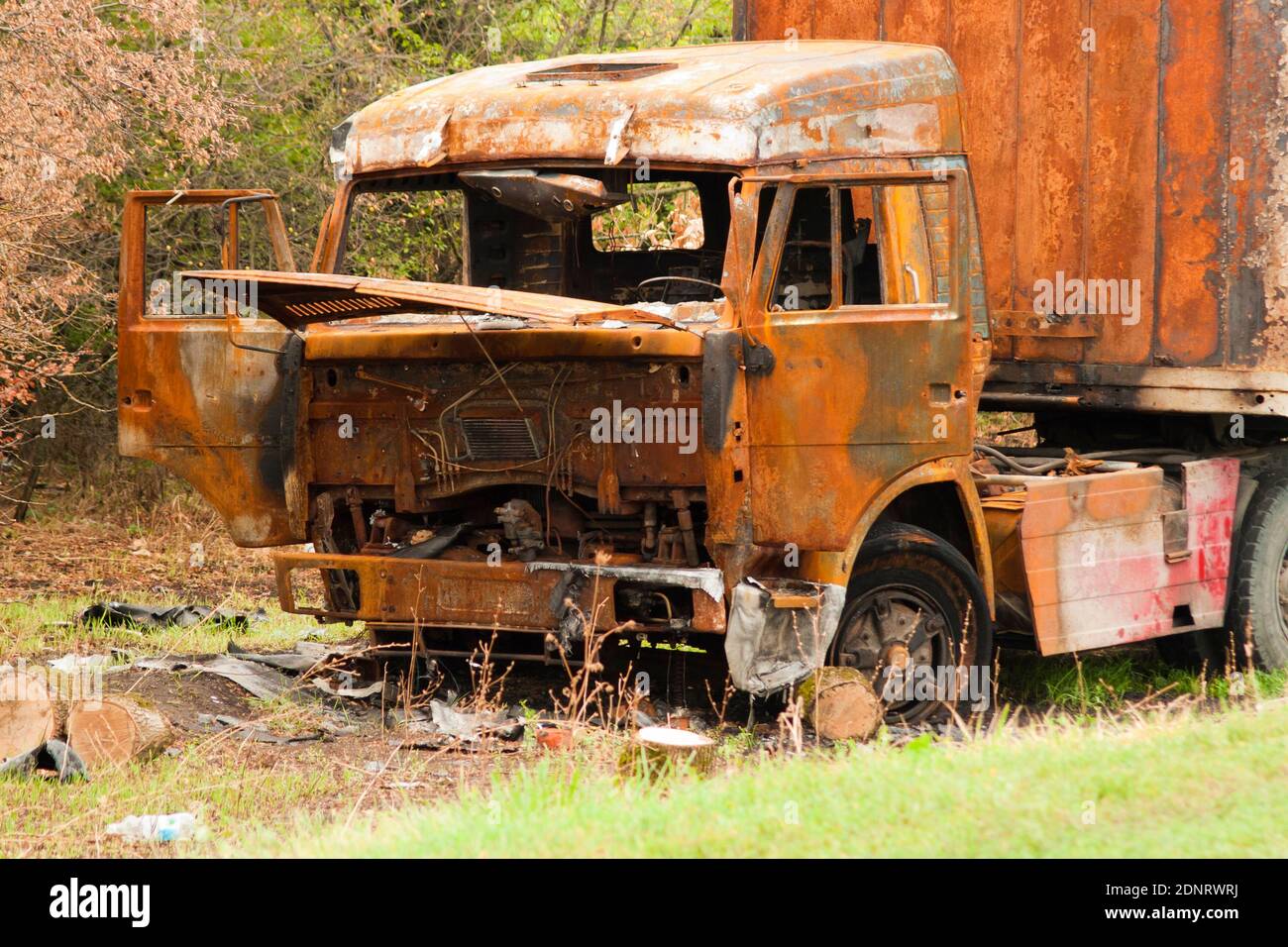 Burnt truck on the side of the road. Fully burnt truck cab on the side ...