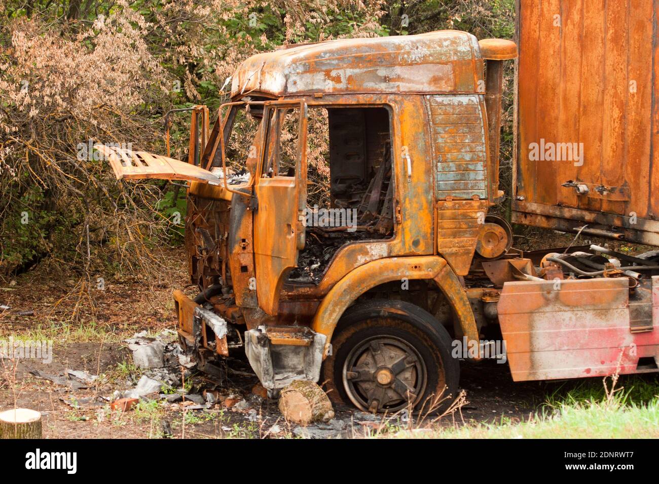 Burnt truck on the side of the road. Fully burnt truck cab on the side ...