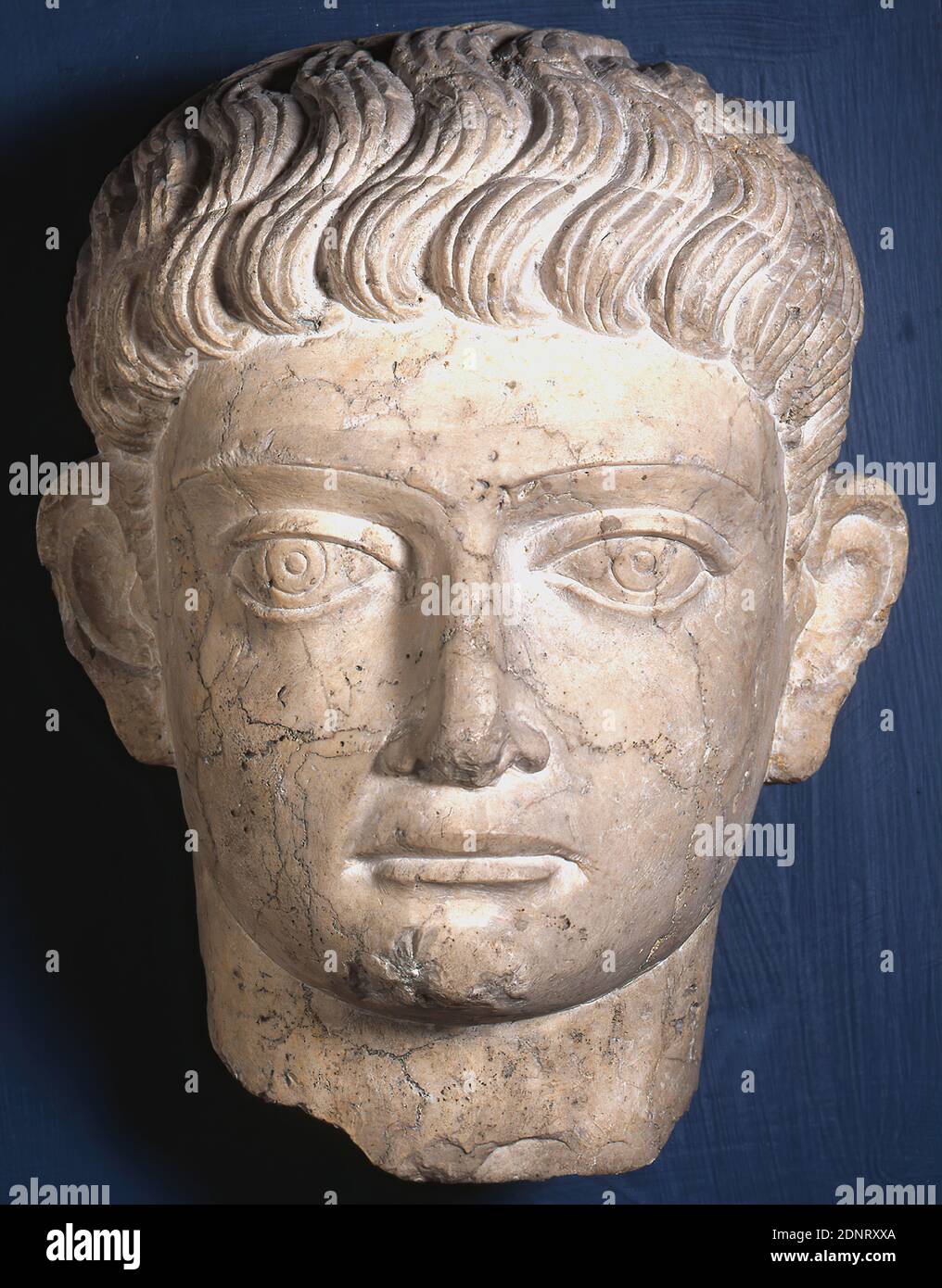 Male head from a tomb relief, limestone, chiseled, drilled, smoothed ...