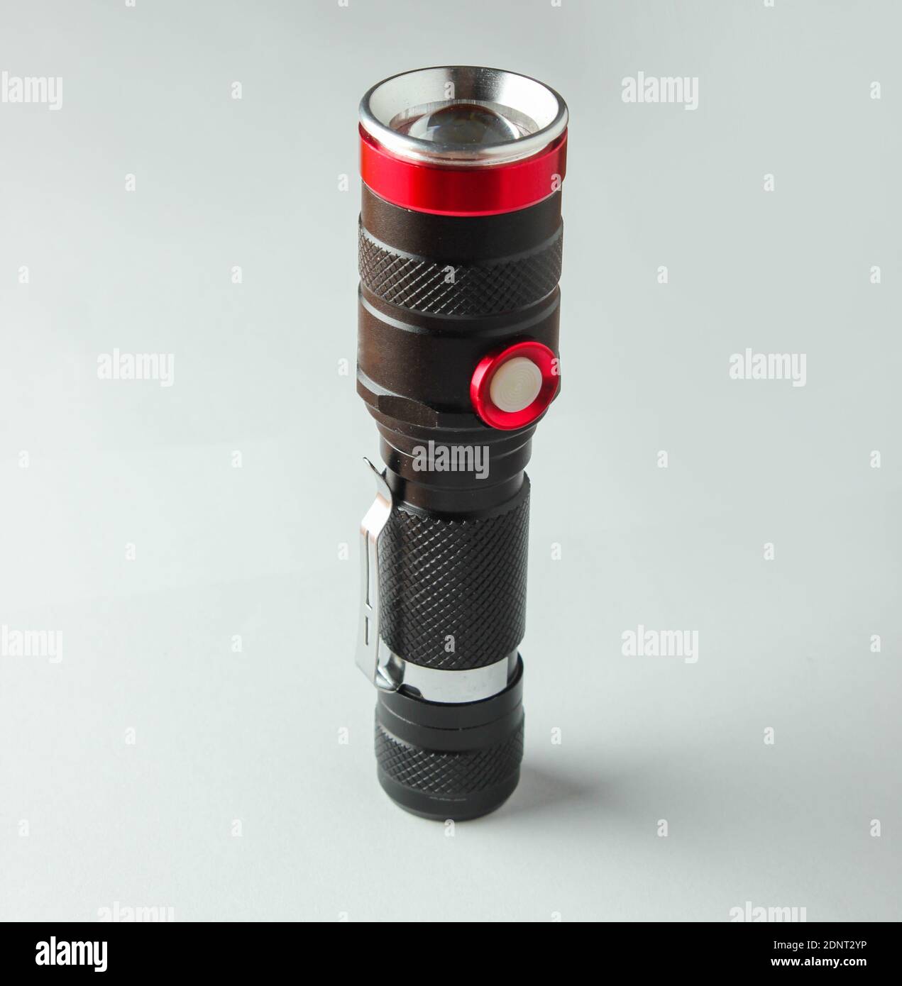 LED flashlight on white background Stock Photo - Alamy