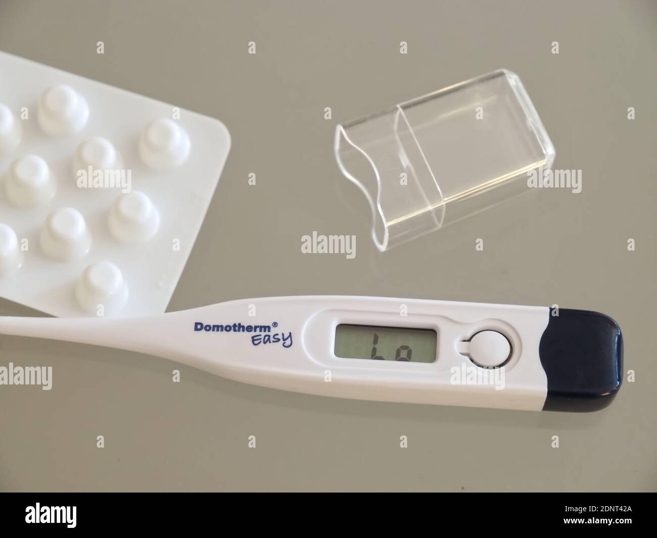 Medical thermometer to measure fever on a glass background Stock Photo ...