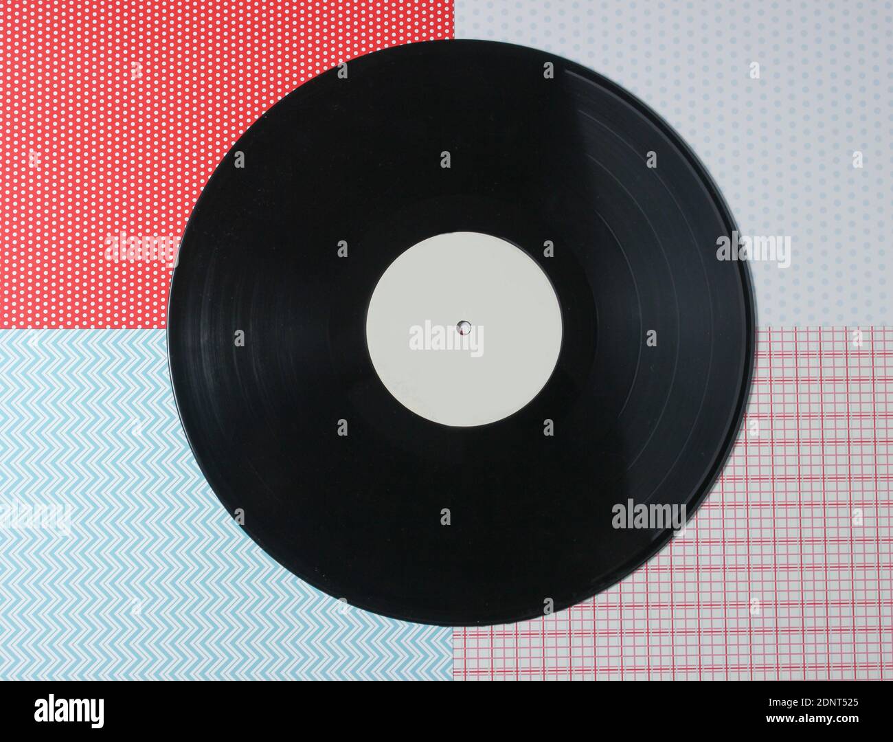 Vinyl plate on a creative background, top view Stock Photo - Alamy