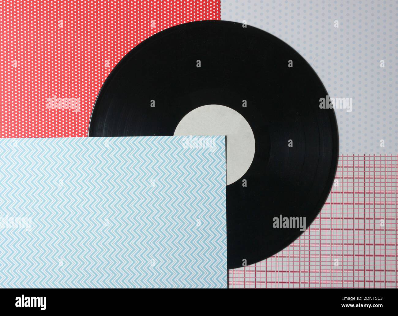 Vinyl plate on a creative background, top view Stock Photo - Alamy