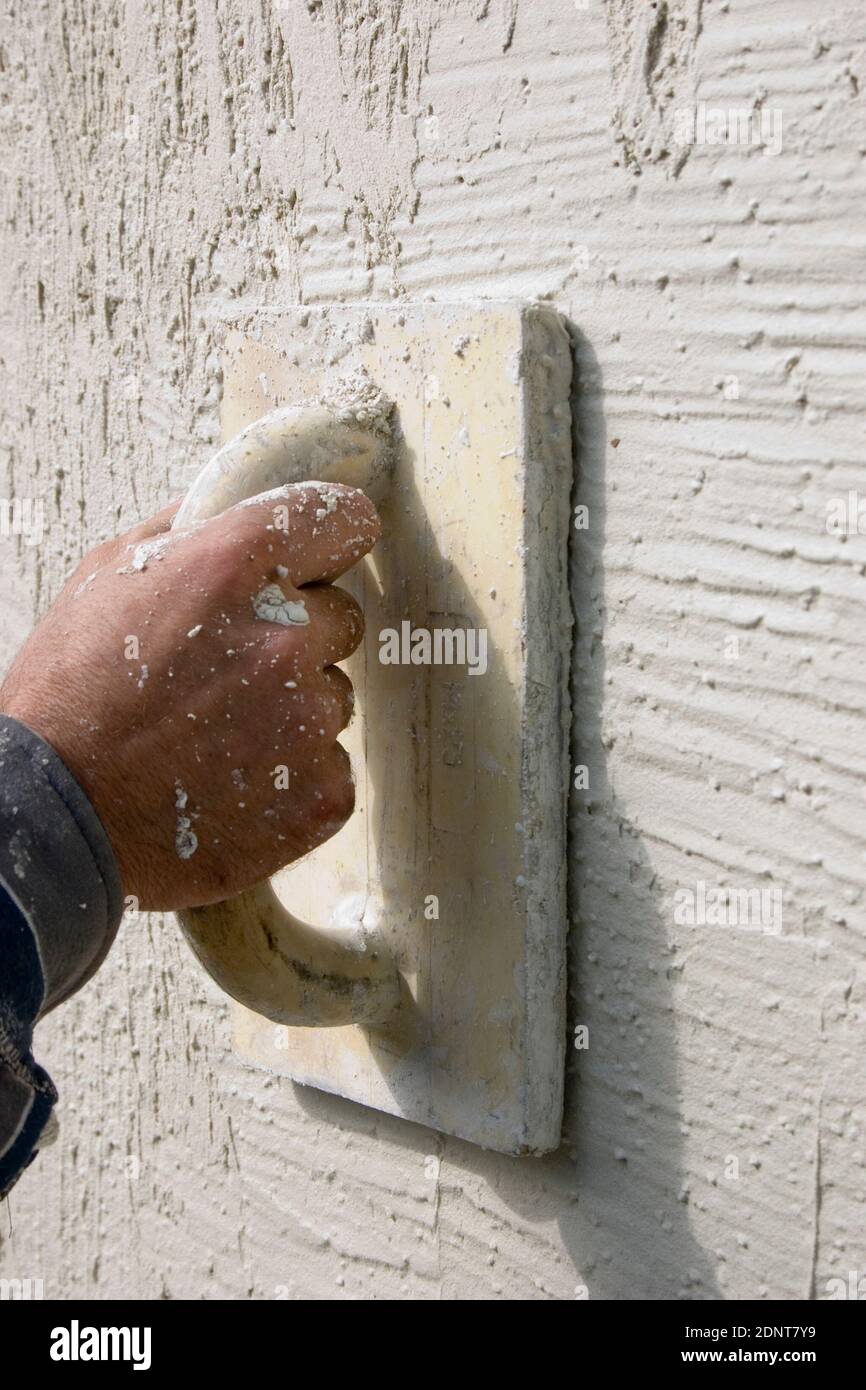 Building background hand plasterer hi-res stock photography and images ...