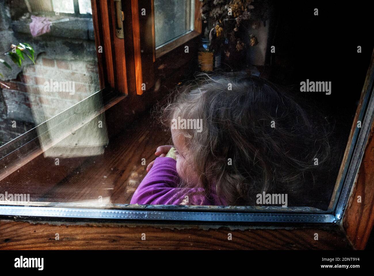 Leaning out the house window hi-res stock photography and images - Alamy