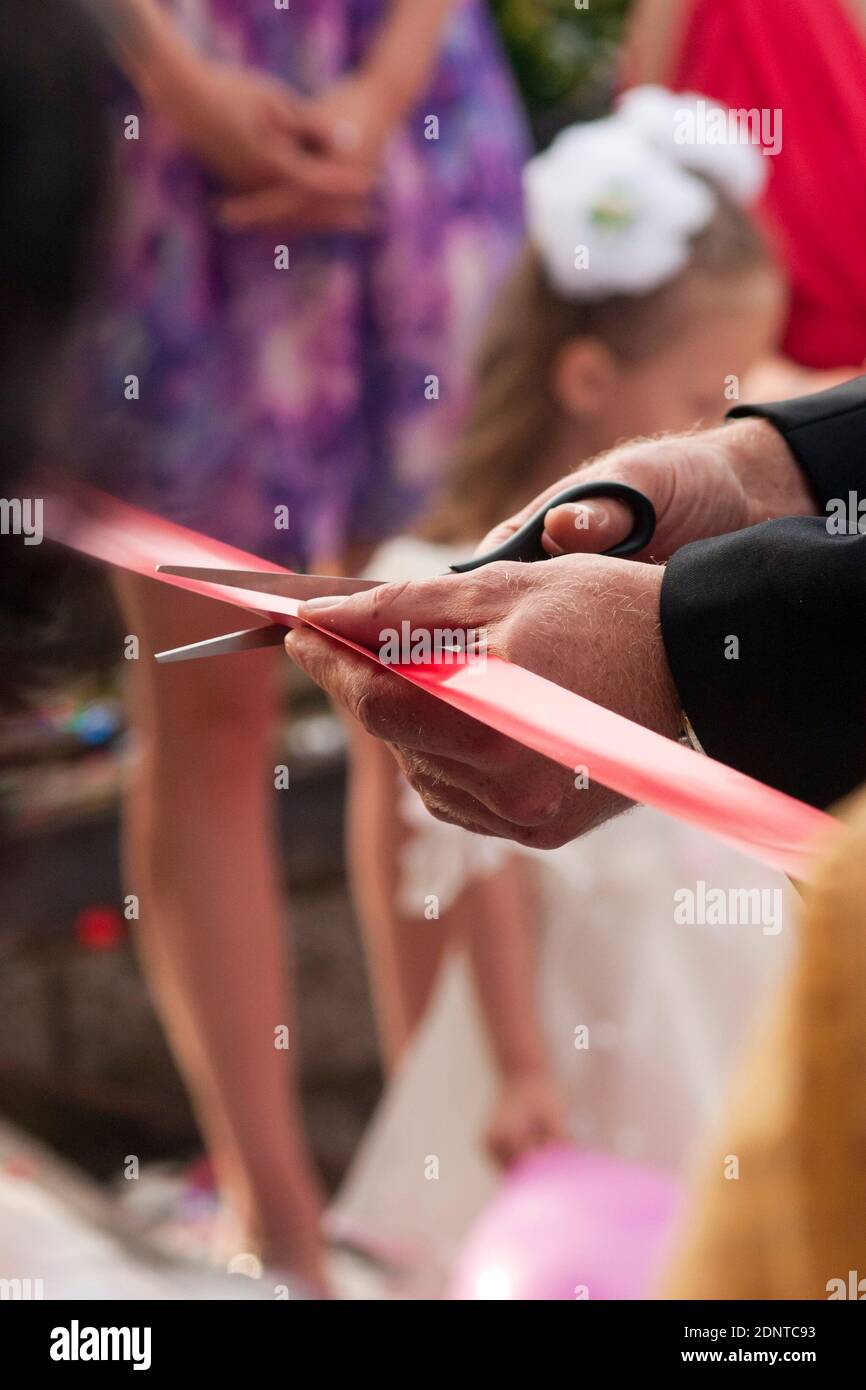 The ceremonial cutting of the red ribbon. Ceremonial red ribbon cutting ...