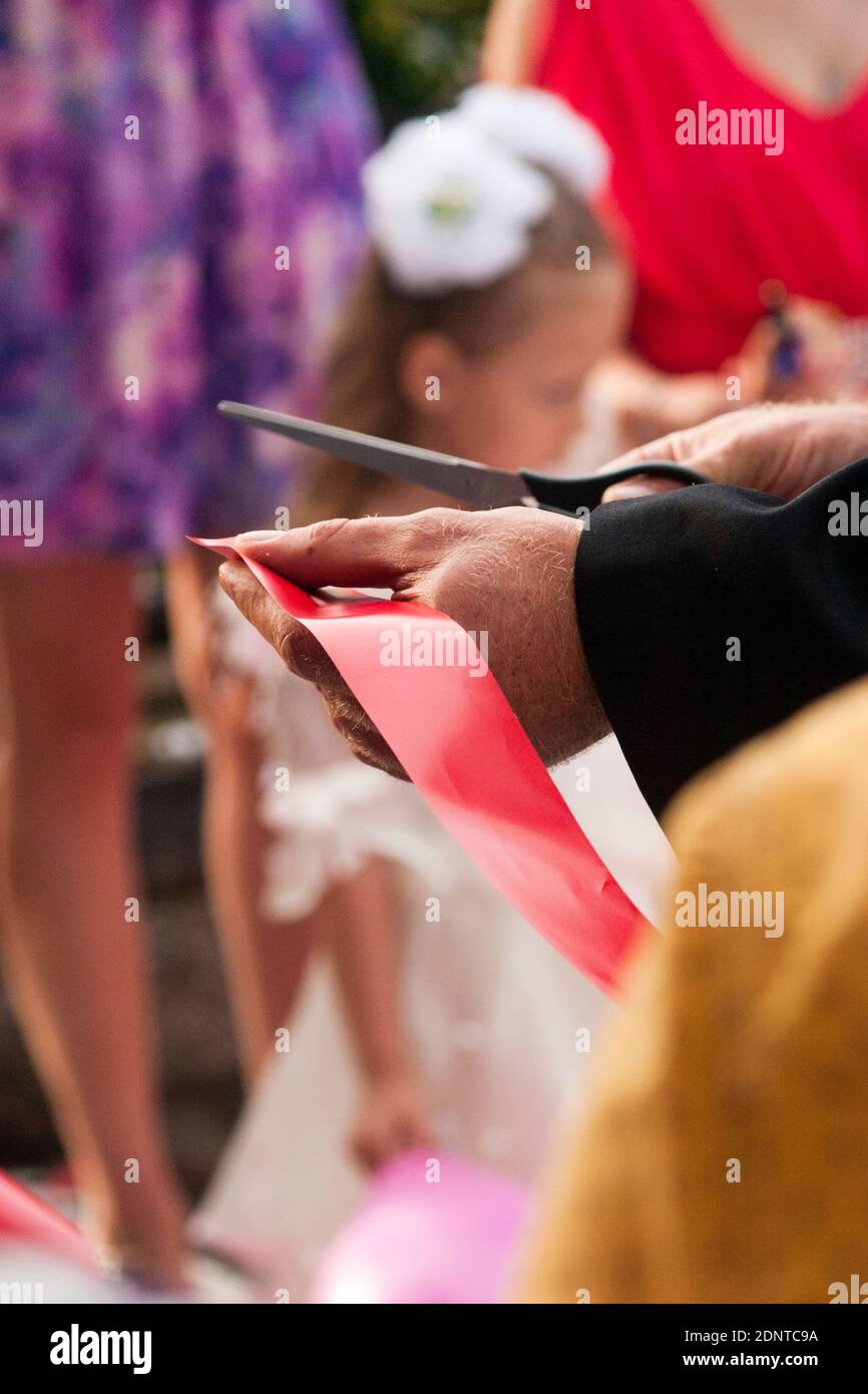 The ceremonial cutting of the red ribbon. Ceremonial red ribbon cutting ...