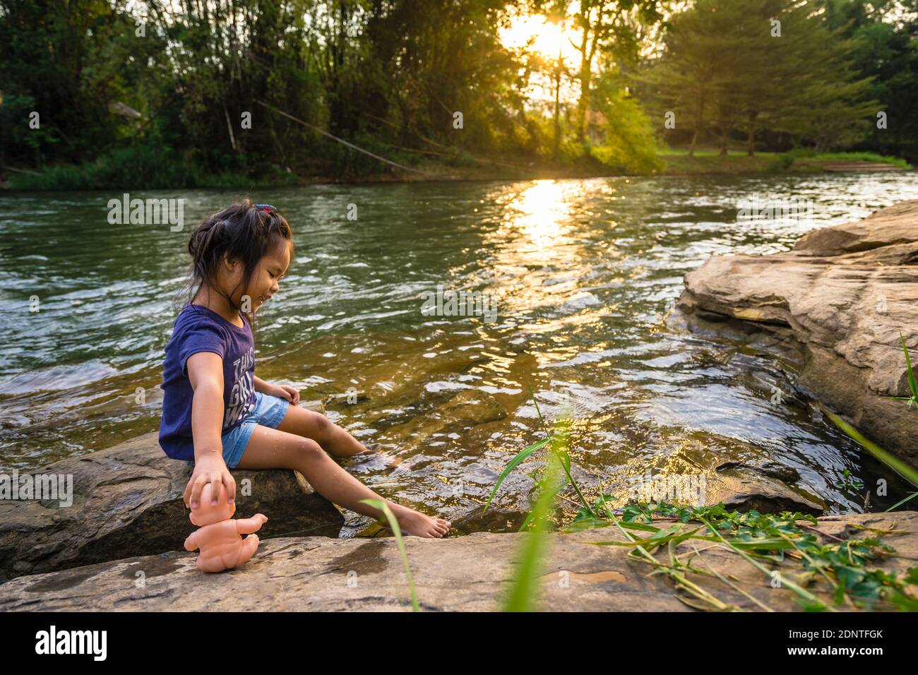 Indian girl playing in river hi-res stock photography and images - Alamy