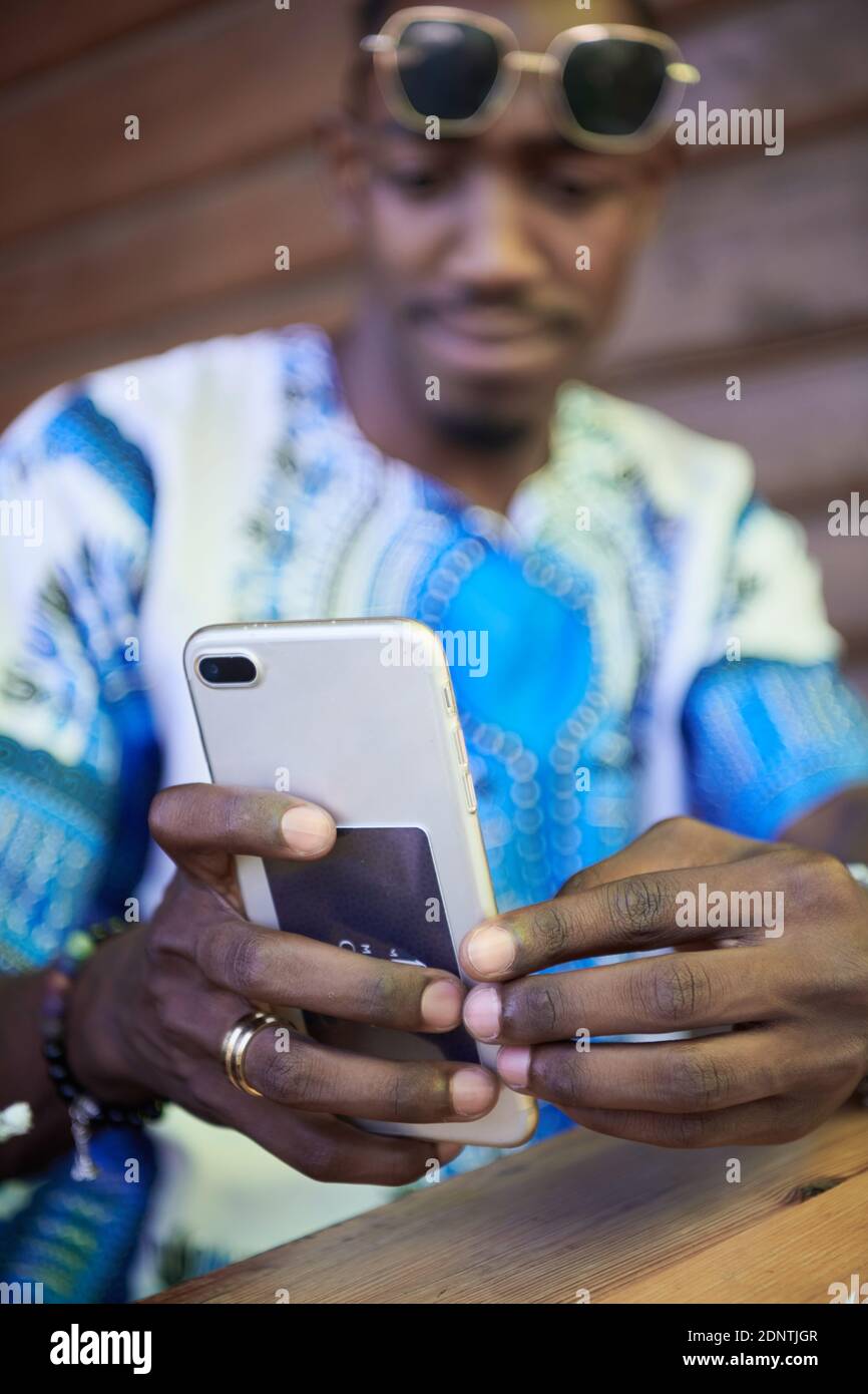 native african black man using smart phone Stock Photo - Alamy