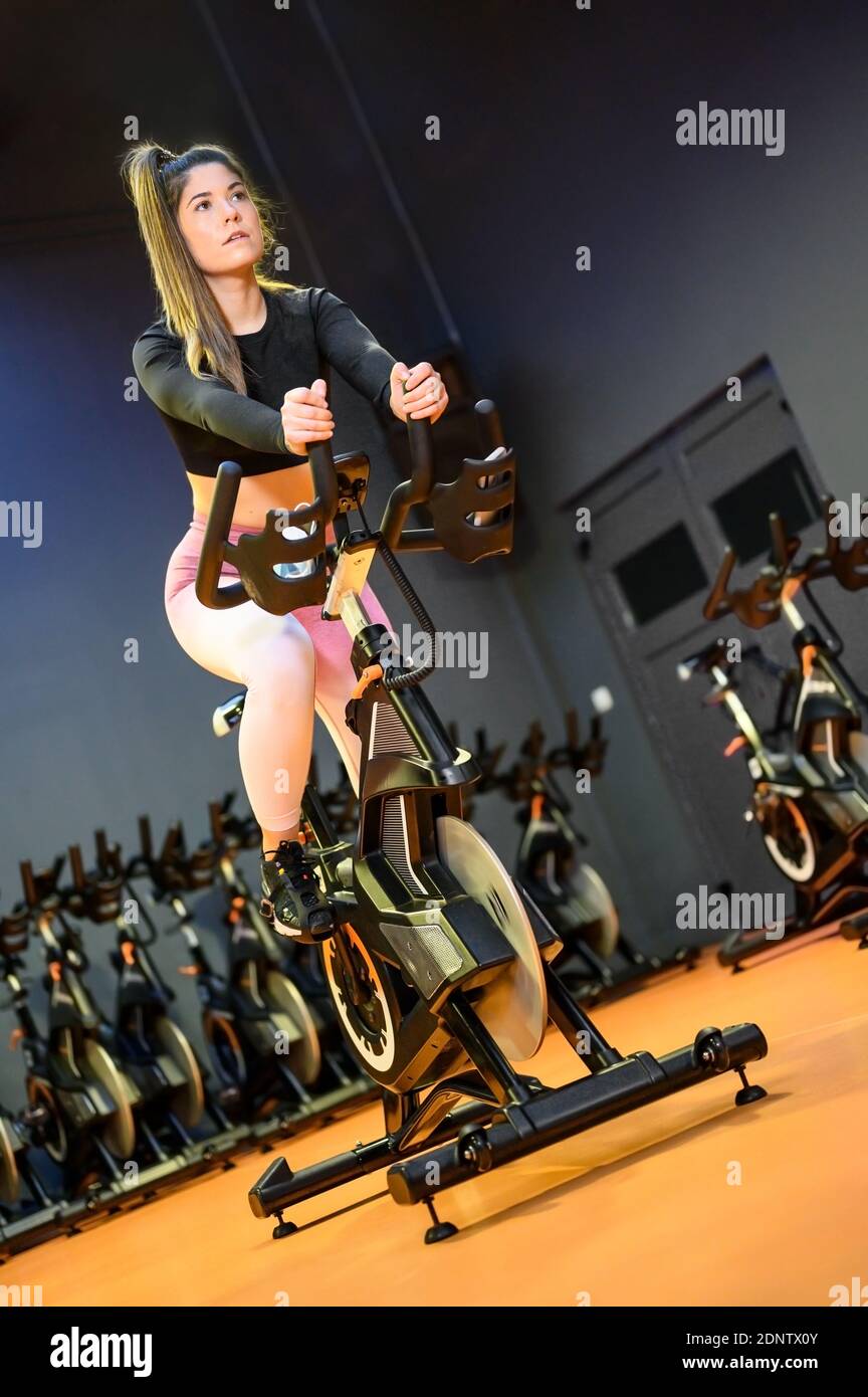 Young happy woman spinning class hi-res stock photography and images ...