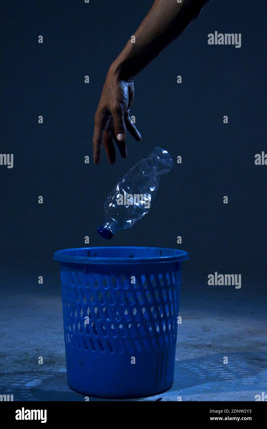 Hand throwing dust bin hi-res stock photography and images - Alamy