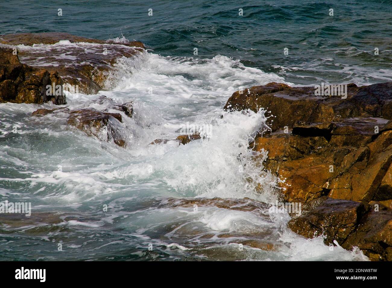 water flowing into the rocks Stock Photo - Alamy