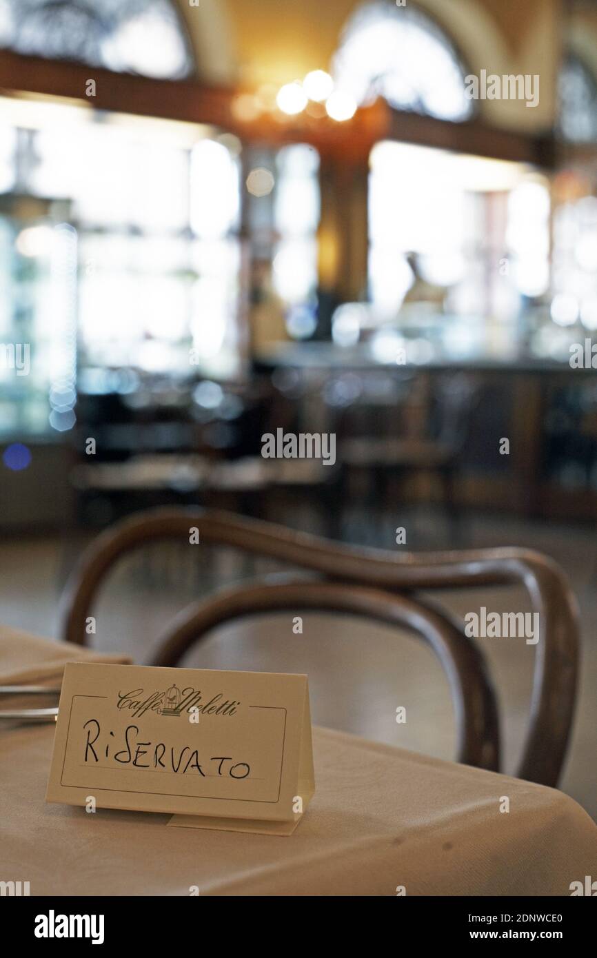 Reserved table in italian cafe Stock Photo - Alamy