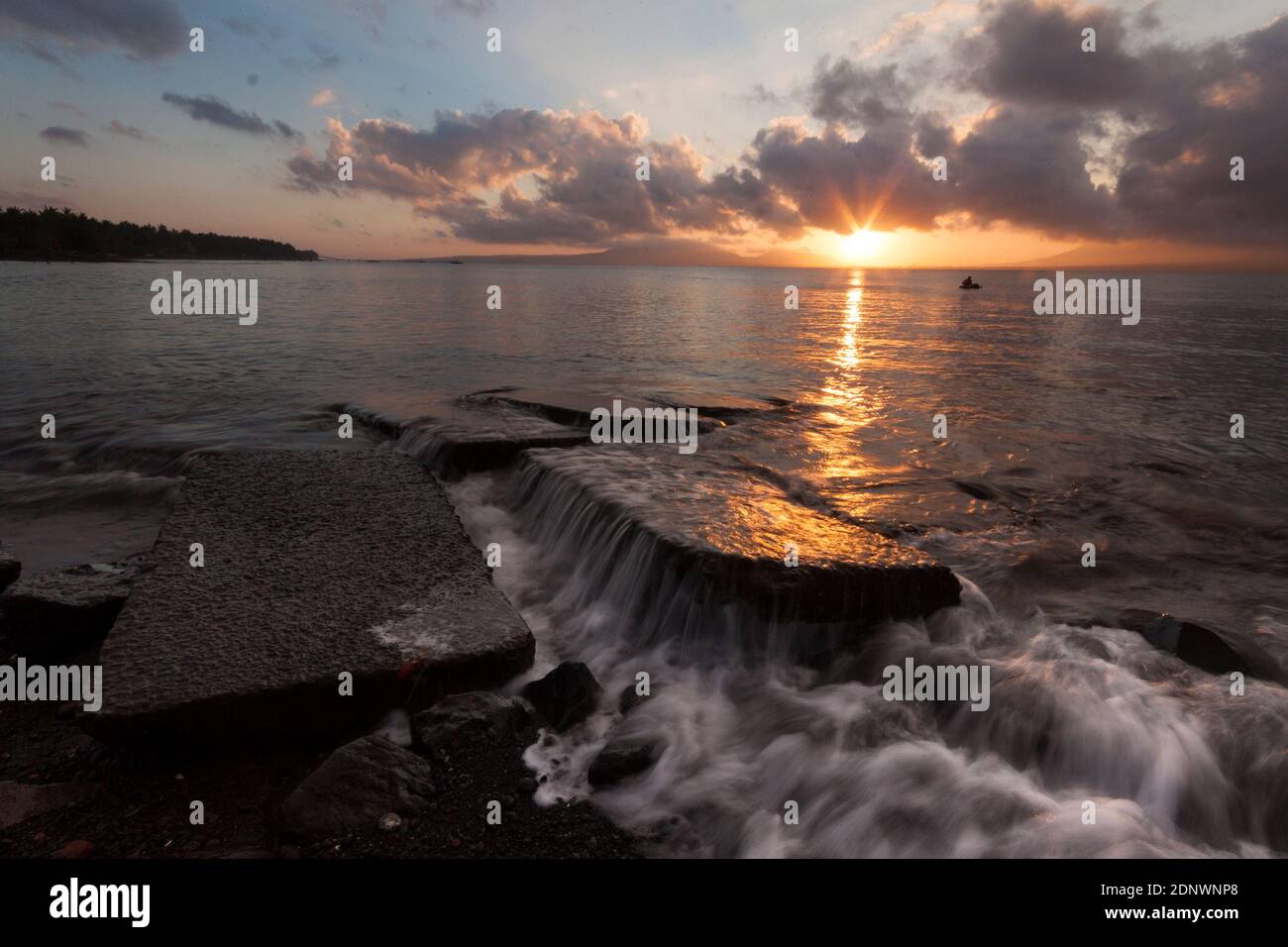 Beautiful sunrise on Cacalan beach, Banyuwangi district Stock Photo - Alamy