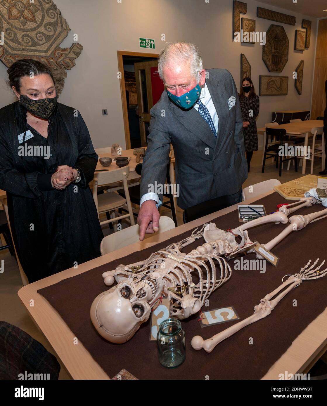 The Prince of Wales looks at a skeleton during a visit to the Corinium ...