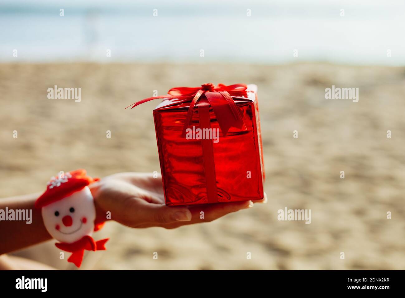 christmas gift box on beach tropical Stock Photo - Alamy