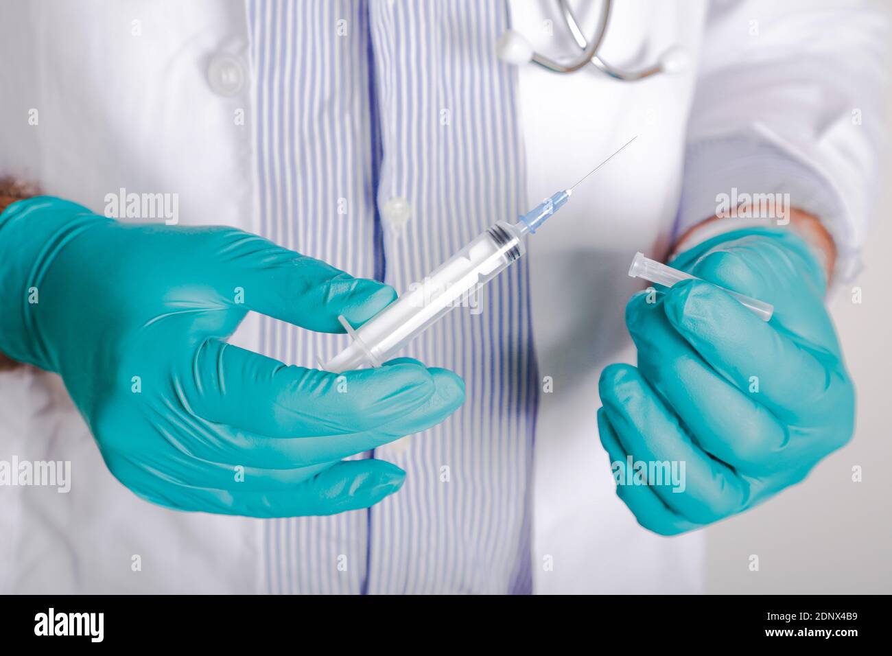 Doctor wearing gloves and mask to protect ourselves from sars-cov virus ...