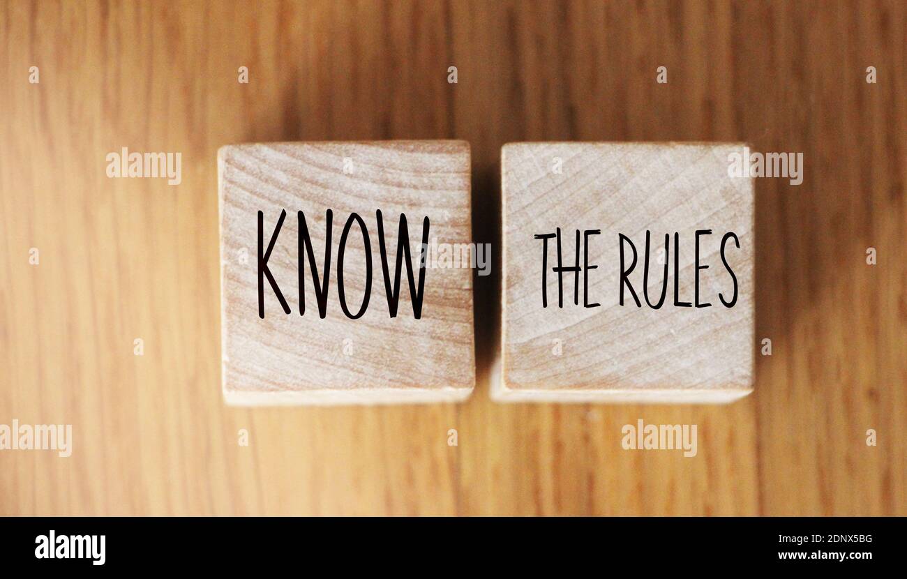 Know the rules word on wooden blocks isolated on dark grey background ...