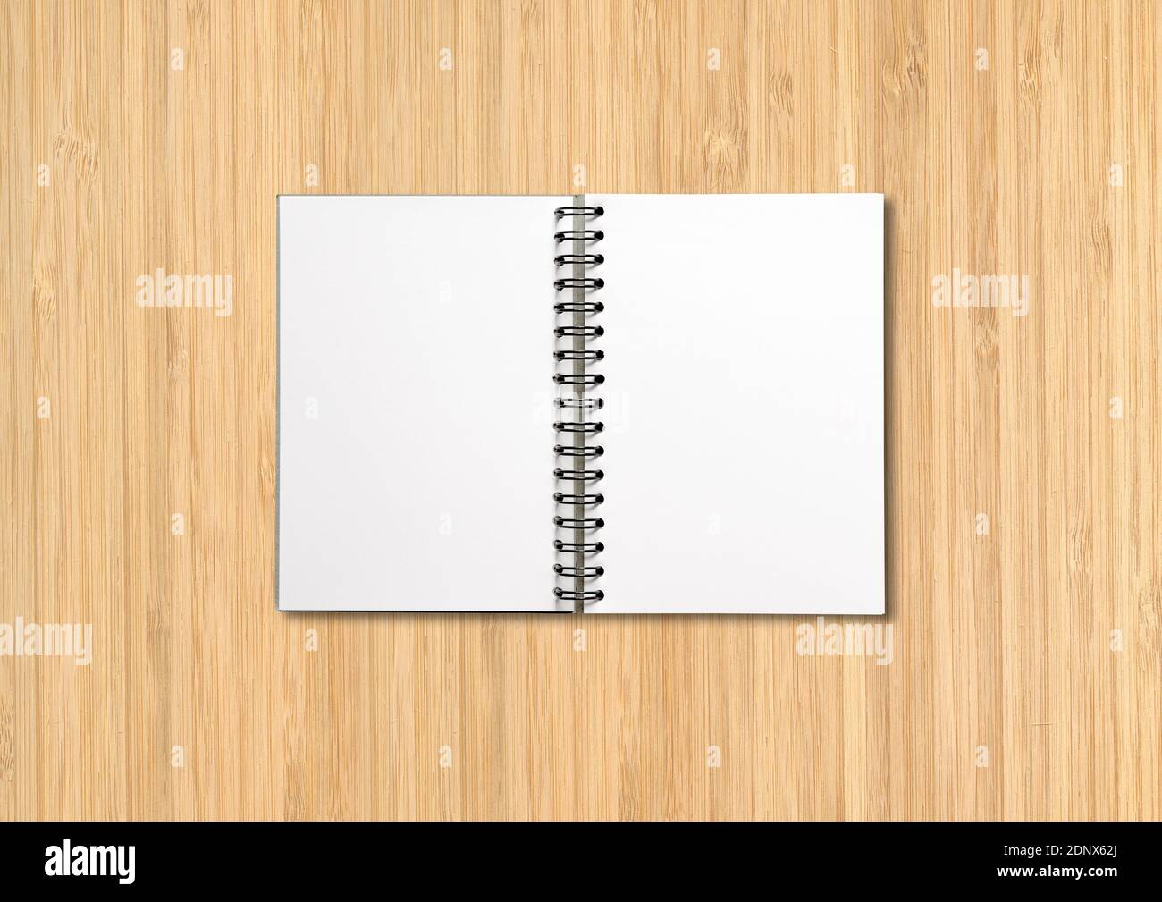 Blank open spiral notebook mockup isolated on wood background Stock ...