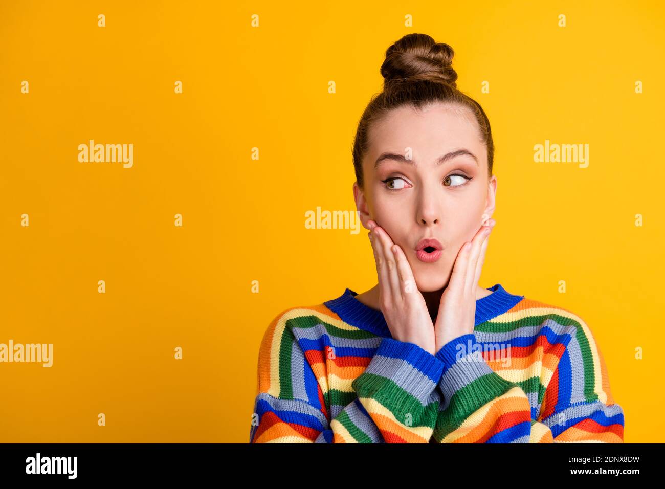 Portrait of astonished impressed girl look copyspace touch face hands ...