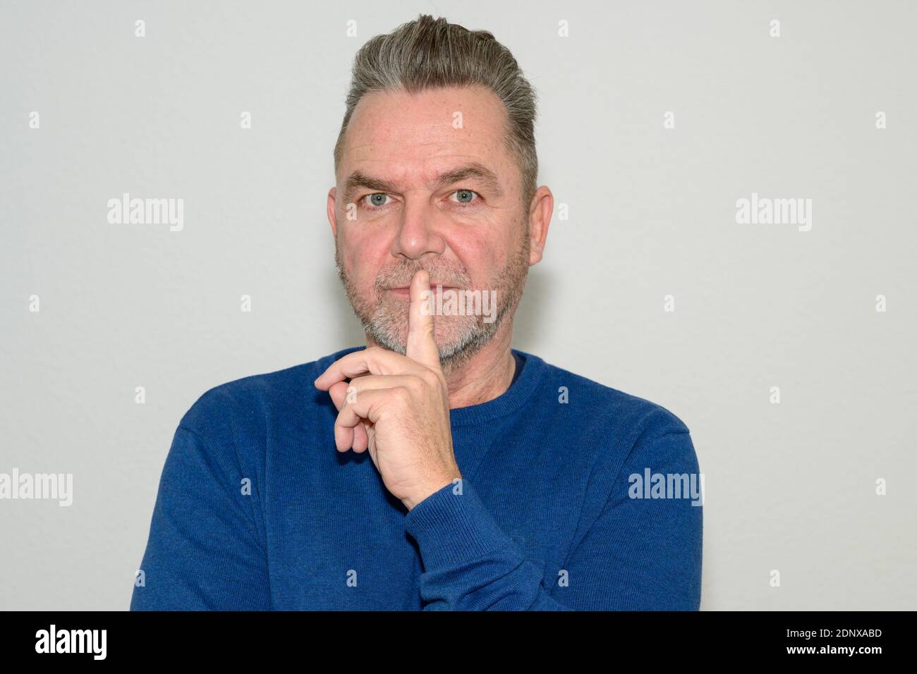 Shushing hi-res stock photography and images - Alamy