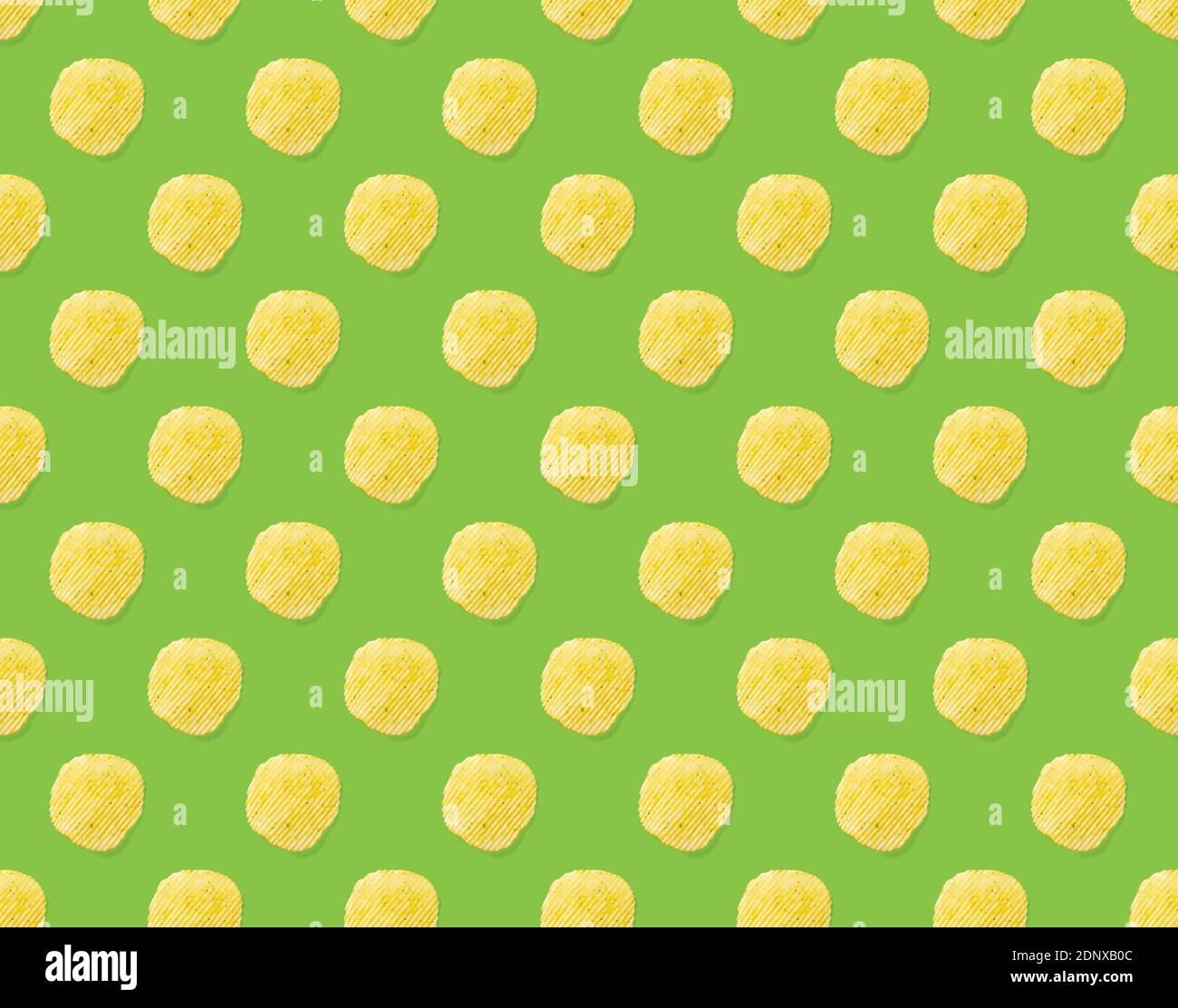 Seamless pattern made from Potato chips on green background flat lay ...