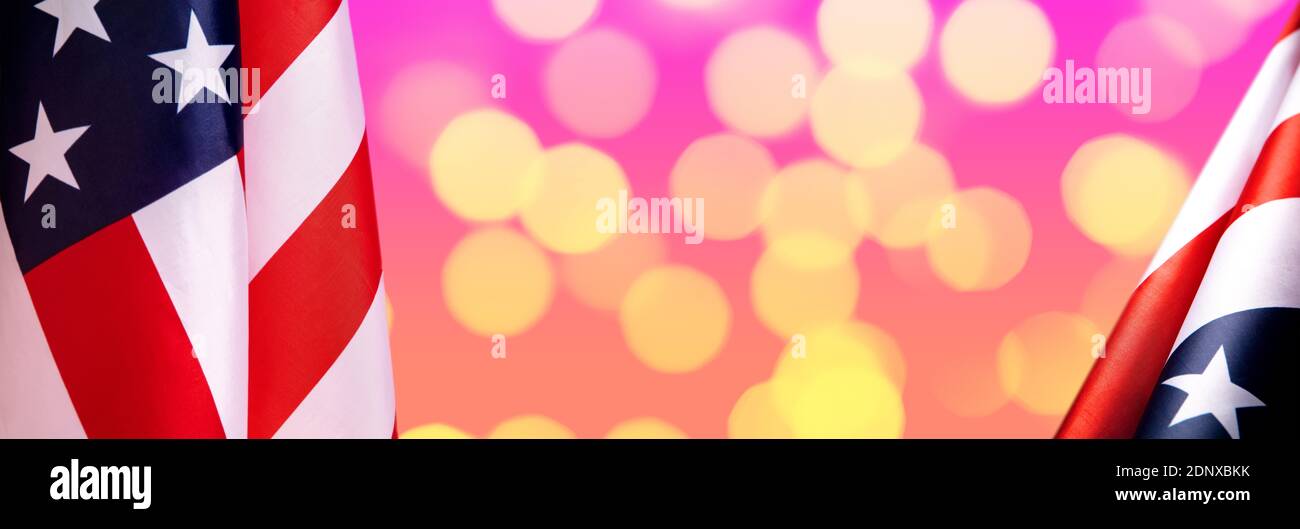 American flags border over defocused pink bokeh lights background ...