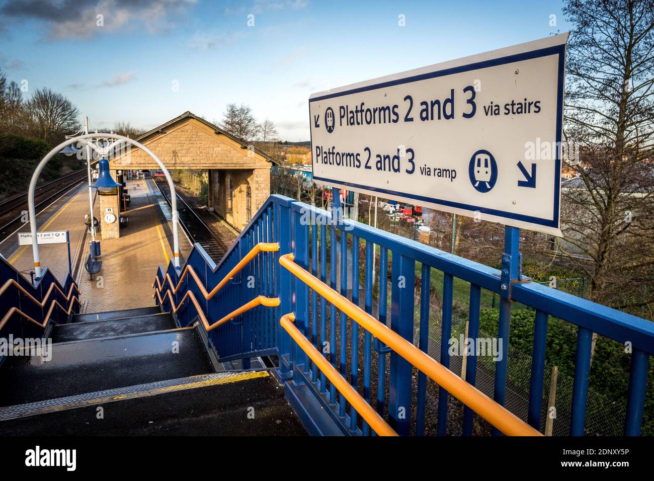 Train station signs pointing to the station platforms Stock Photo - Alamy