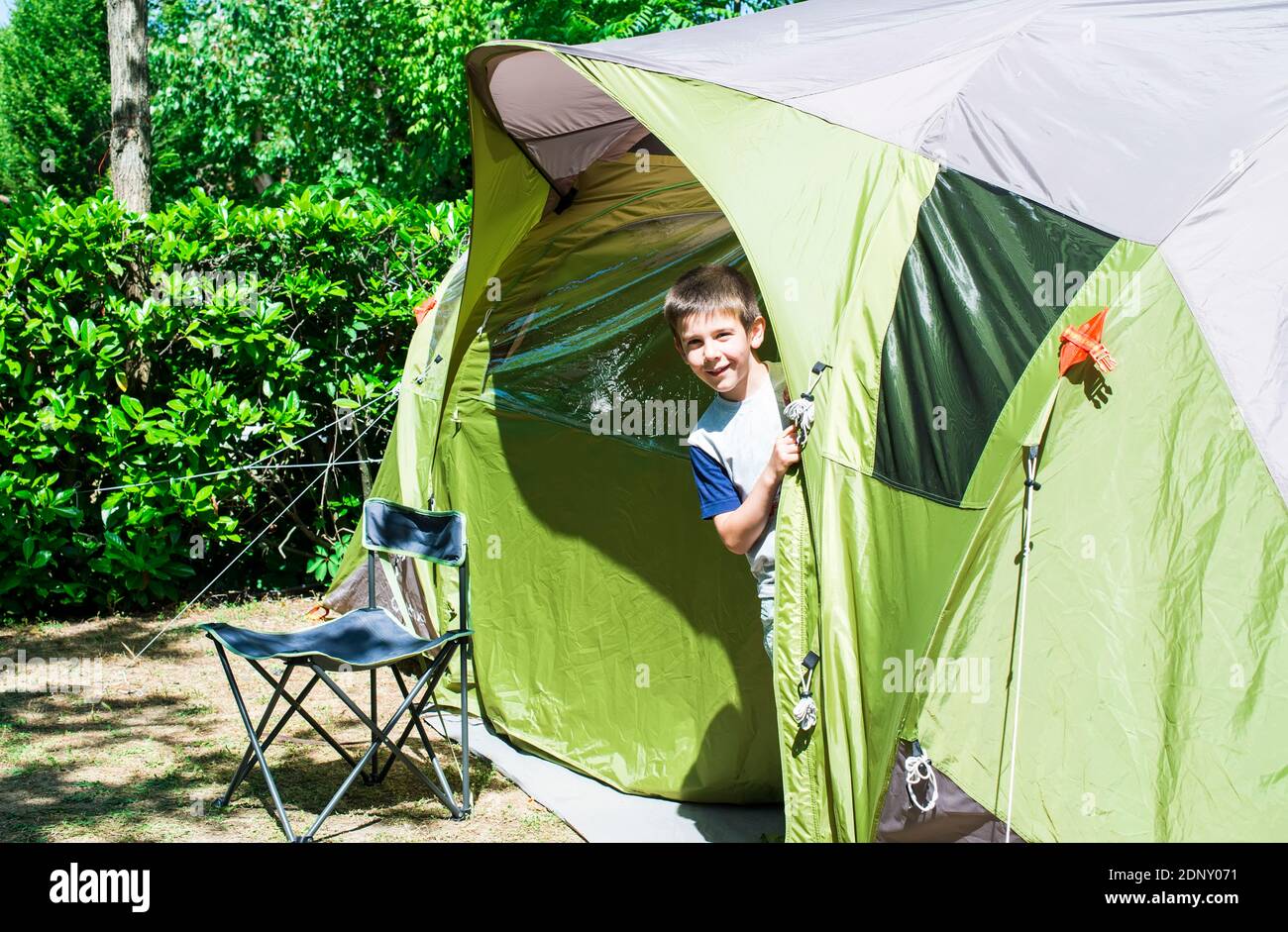 Standing childhood smiling looking at camera tent hi-res stock ...