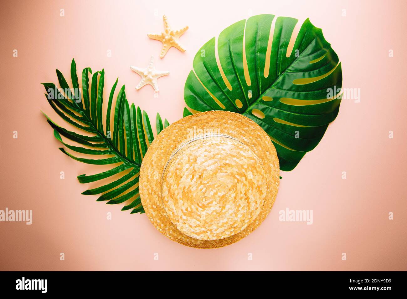Straw beach hat and sun glasses top view on pink background, summer ...